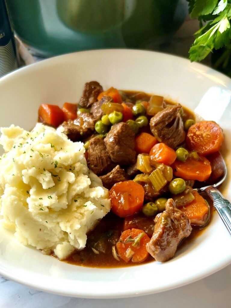 Guinness Irish Beef Stew Over Creamy Mashed Potatoes - The Menu Maid